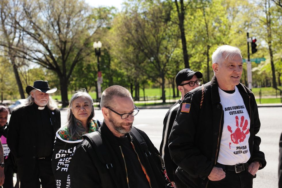 HIV and AIDS activists stack coffins. to protest PEPFAR cuts | Advocate.com