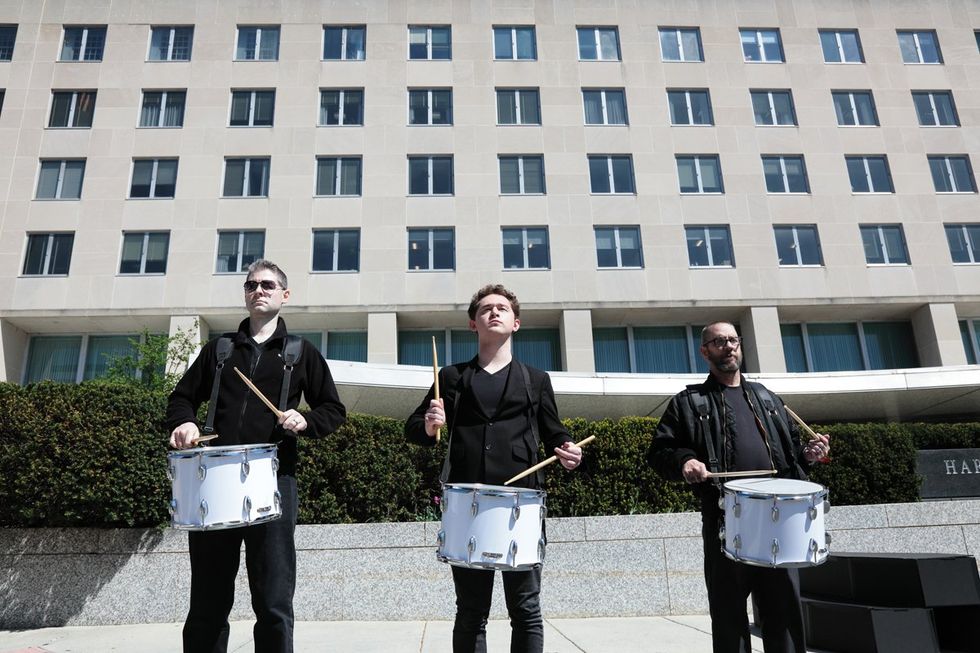 HIV and AIDS activists stack coffins. to protest PEPFAR cuts